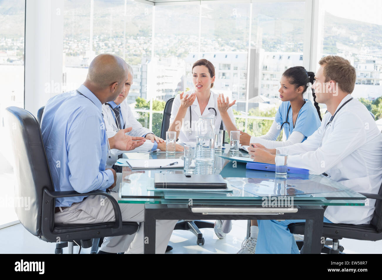 Team of doctors having a meeting Stock Photo - Alamy