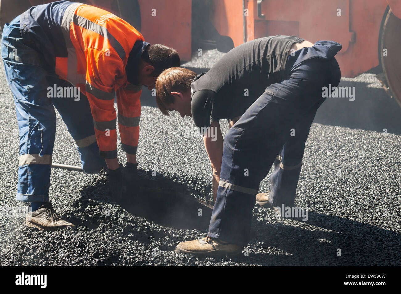Saint-Petersburg, Russia - May 30, 2015: men at work, urban road under ...
