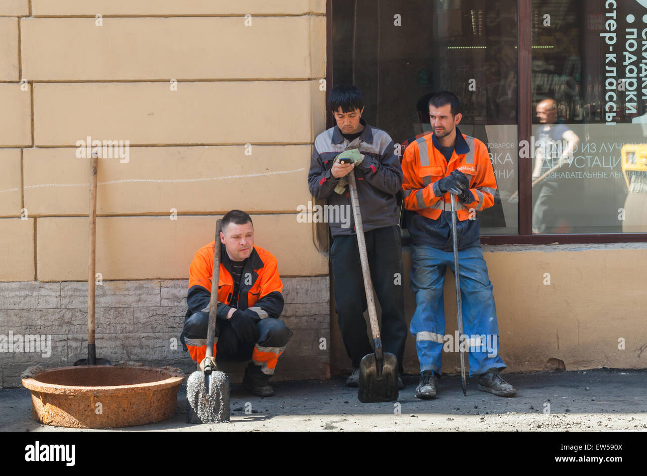 Saint-Petersburg, Russia - May 30, 2015: men at work, urban road under ...