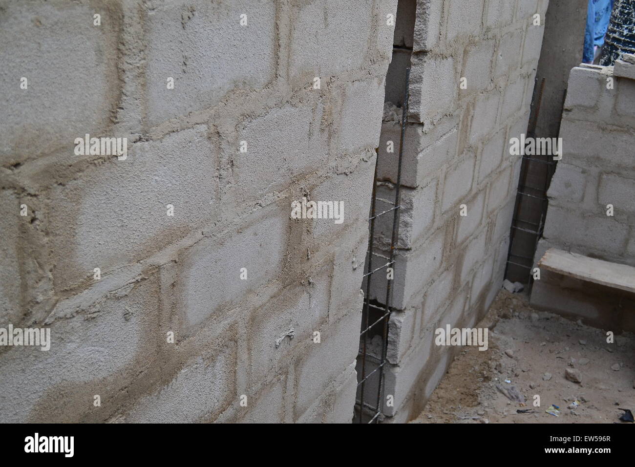 Wall with iron rods embedded Stock Photo - Alamy