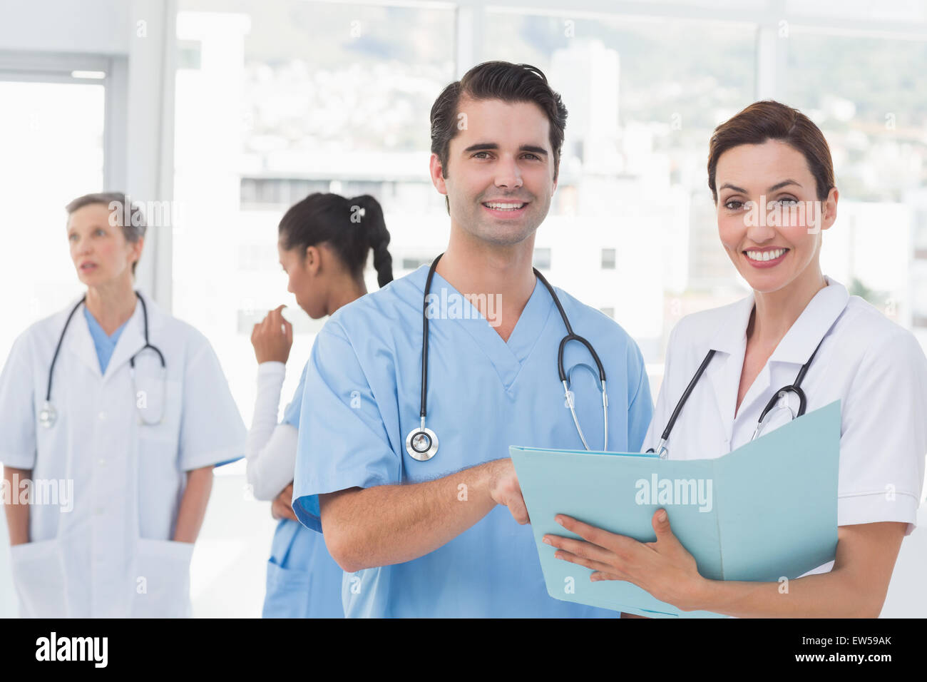 Team of doctors working on their files Stock Photo - Alamy