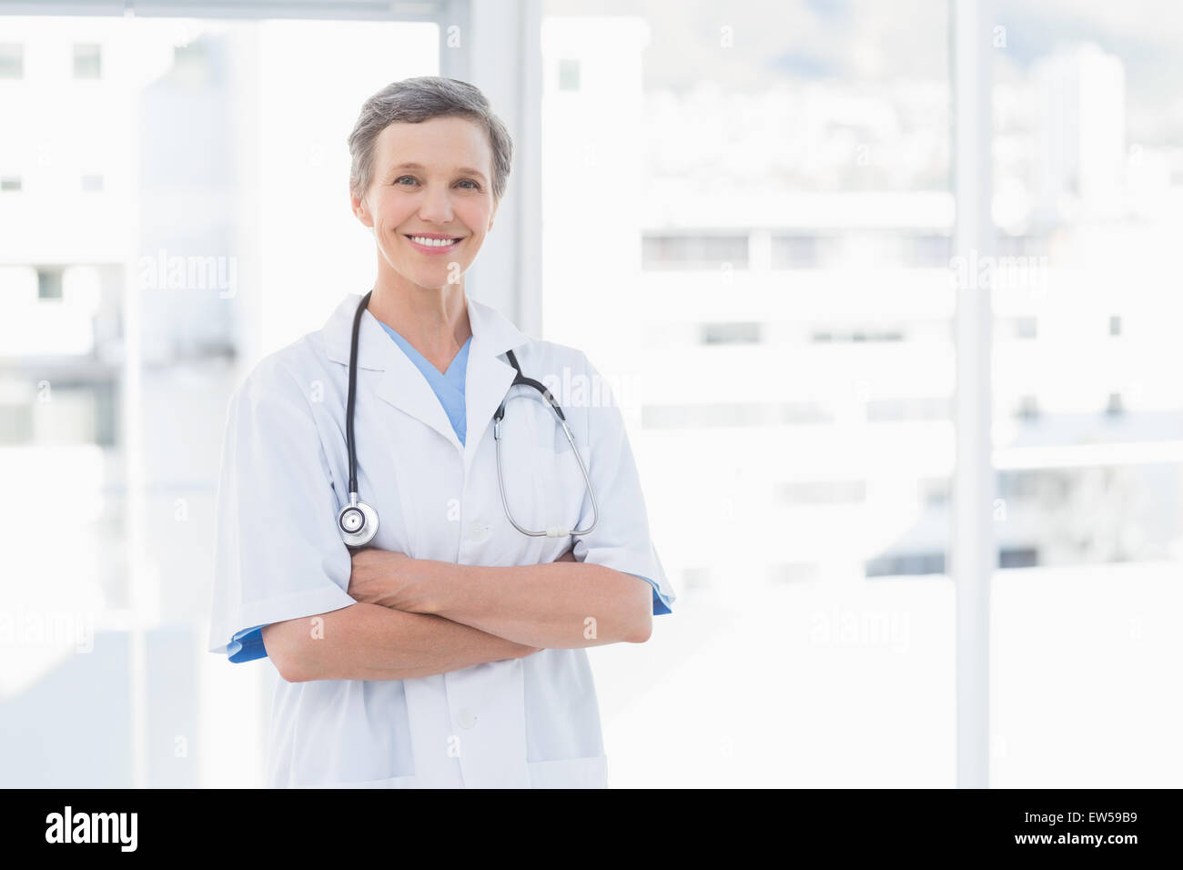 Smiling female doctor Stock Photo - Alamy