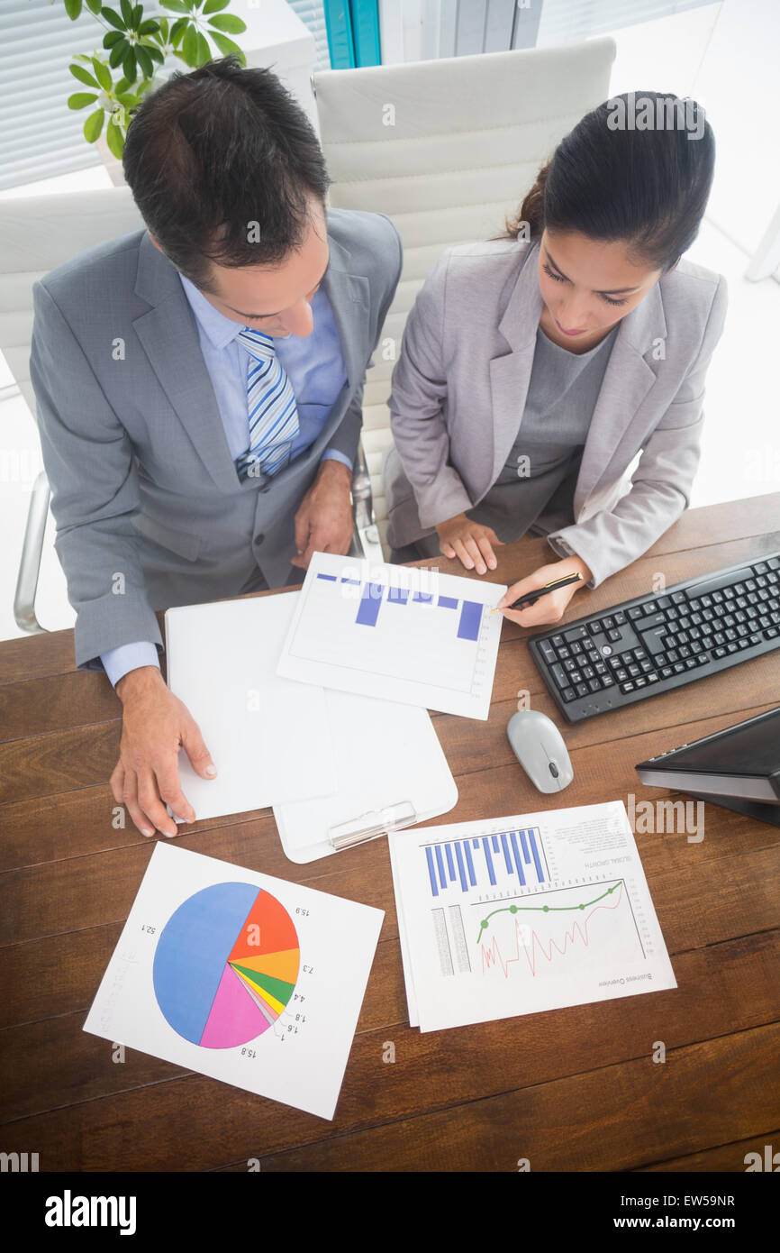 Businesswoman working with team mate Stock Photo - Alamy
