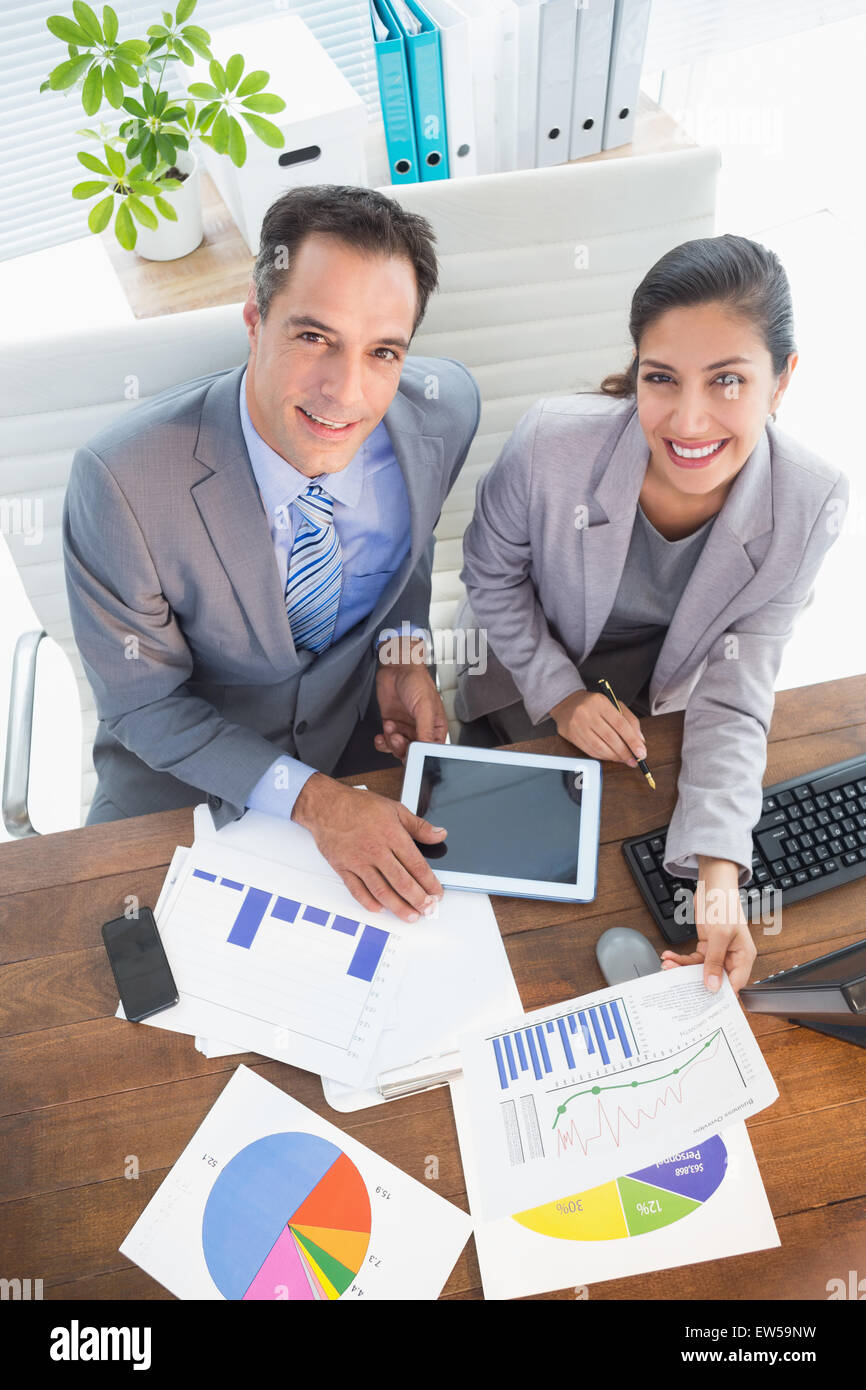 Businesswoman working with team mate Stock Photo - Alamy