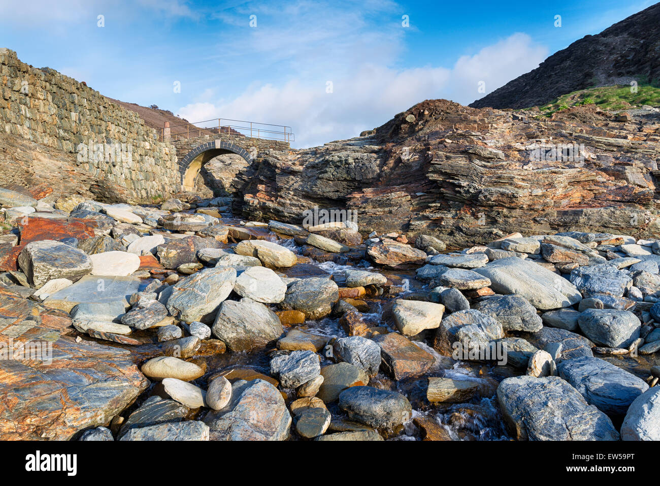 A stone bridge over the stream at Trevellas Coombe beach at St Agnes in ...
