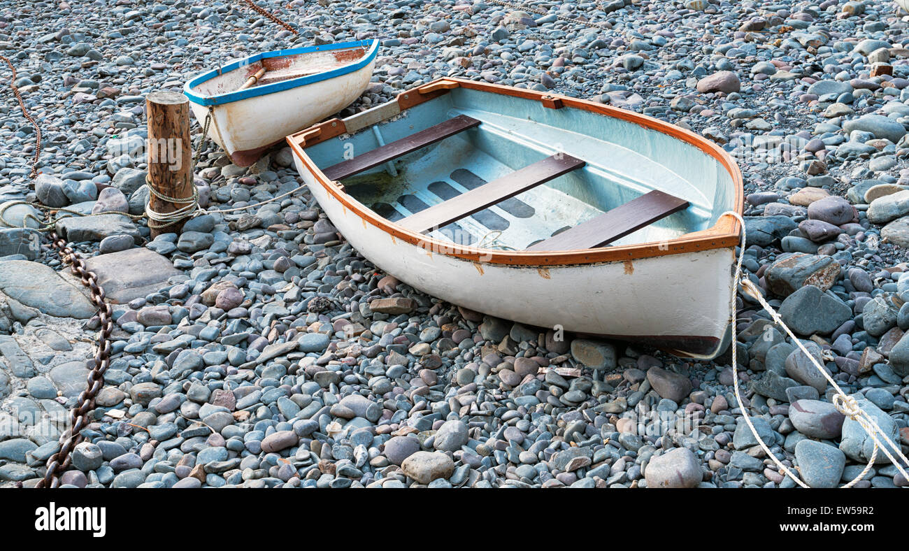 Rowing boats on a pebble beach Stock Photo - Alamy