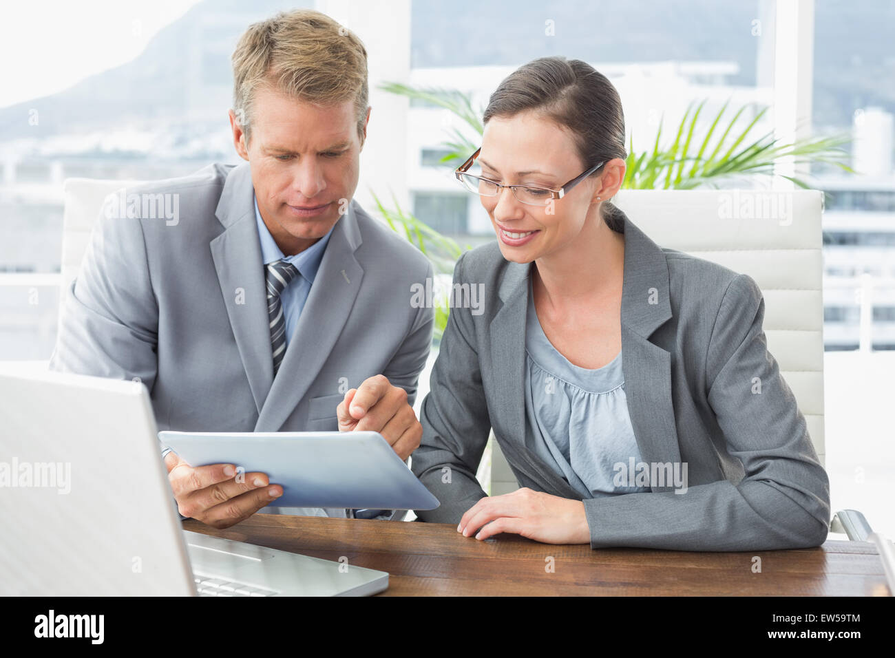 Business partners working together Stock Photo - Alamy