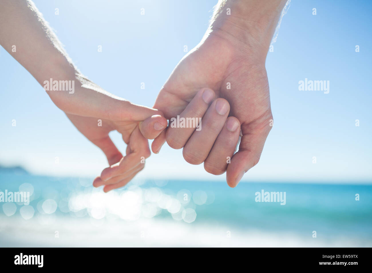Couple hand in hand Stock Photo - Alamy