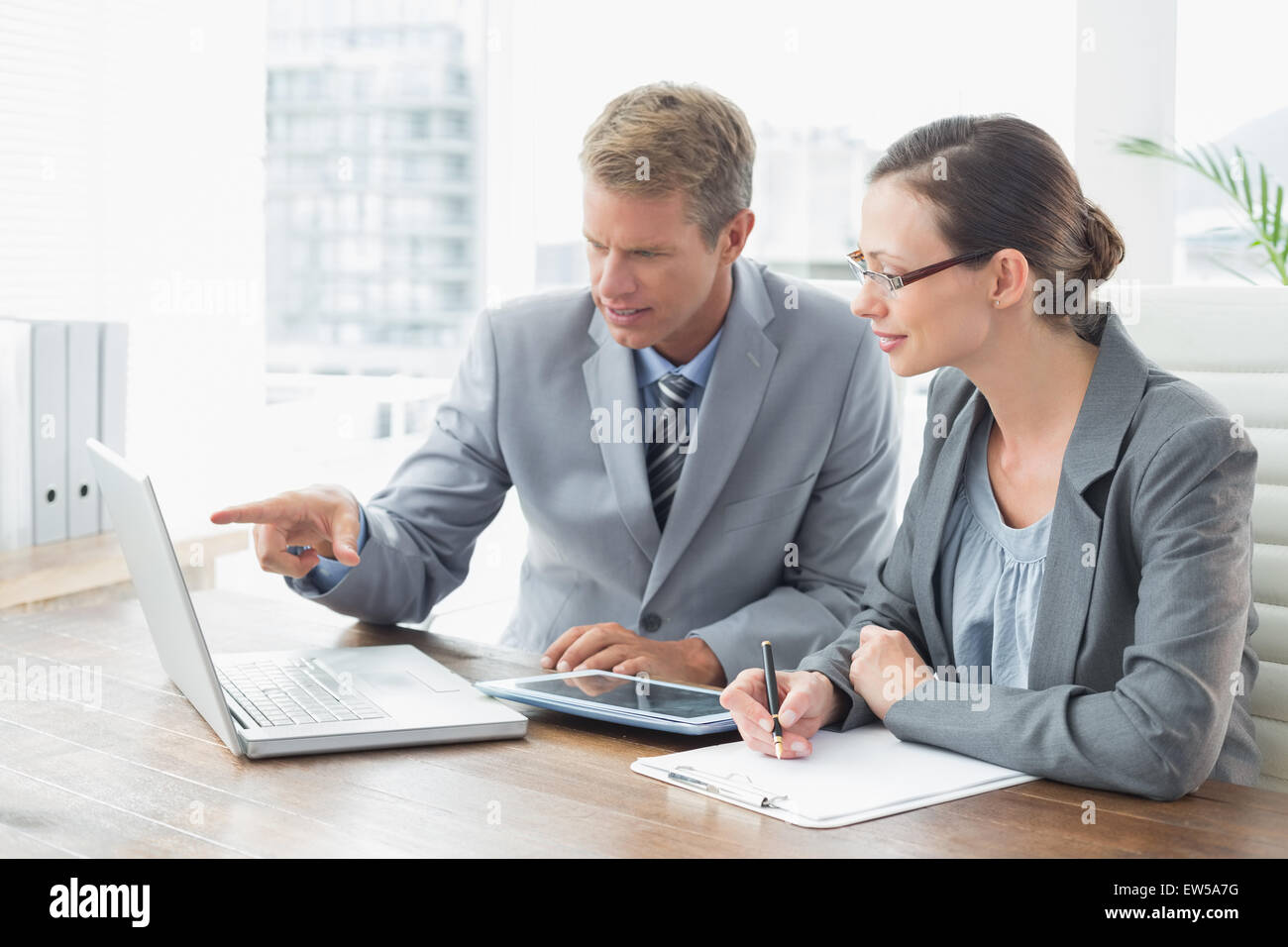 Business partners working together Stock Photo - Alamy