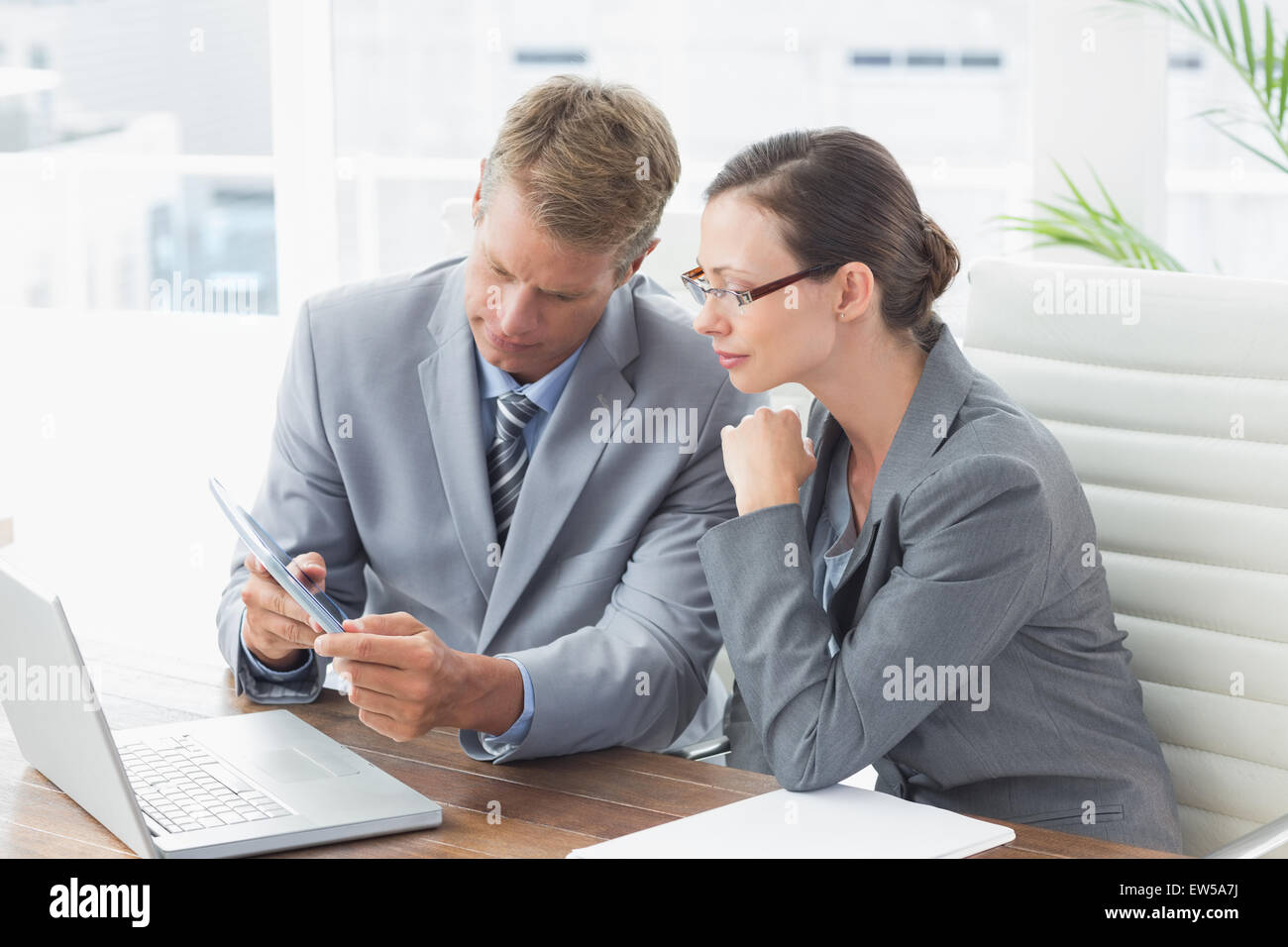Business partners working together Stock Photo - Alamy