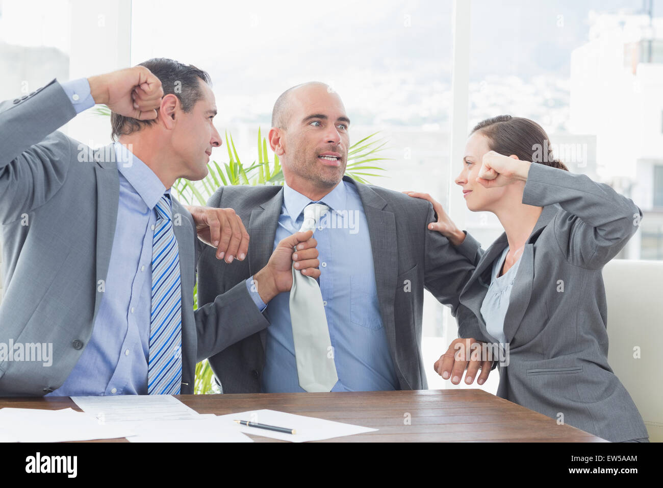 Business partners fighting together Stock Photo - Alamy