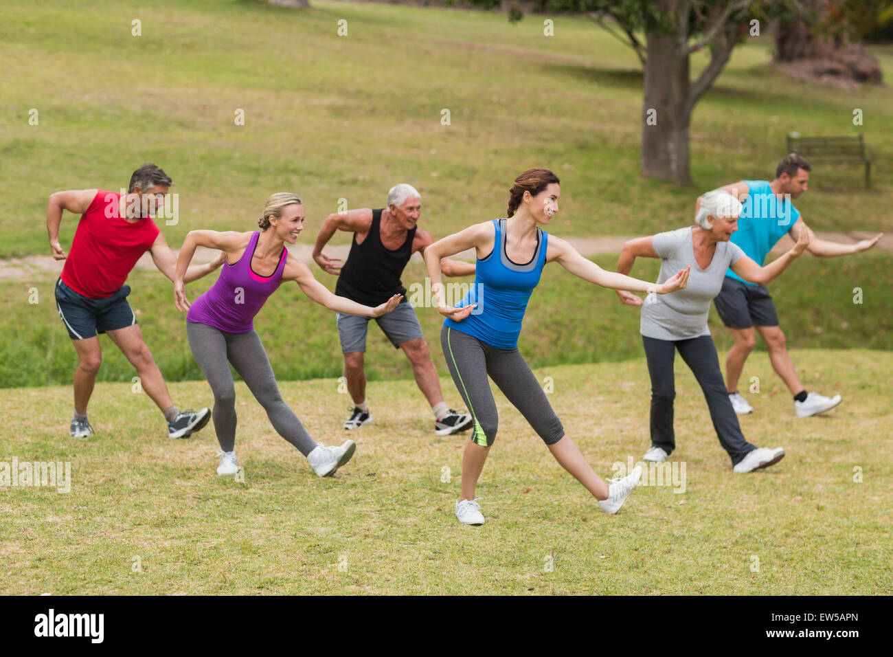 Happy athletic group training Stock Photo - Alamy
