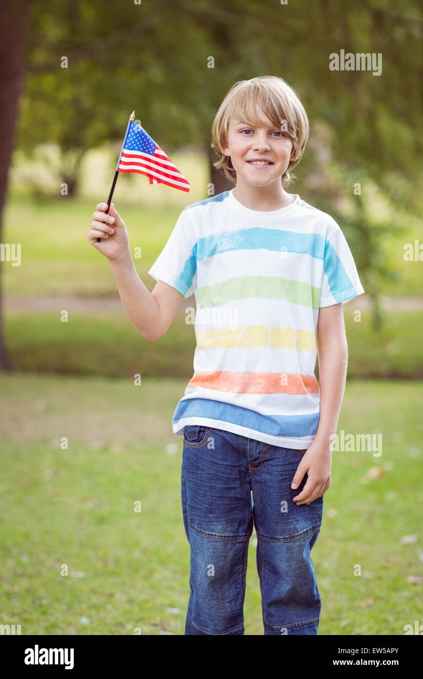 Young boy holding an american flag Stock Photo - Alamy