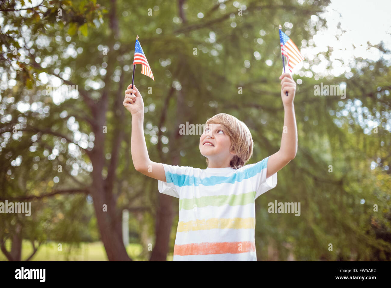Boy holding american flag hi-res stock photography and images - Alamy