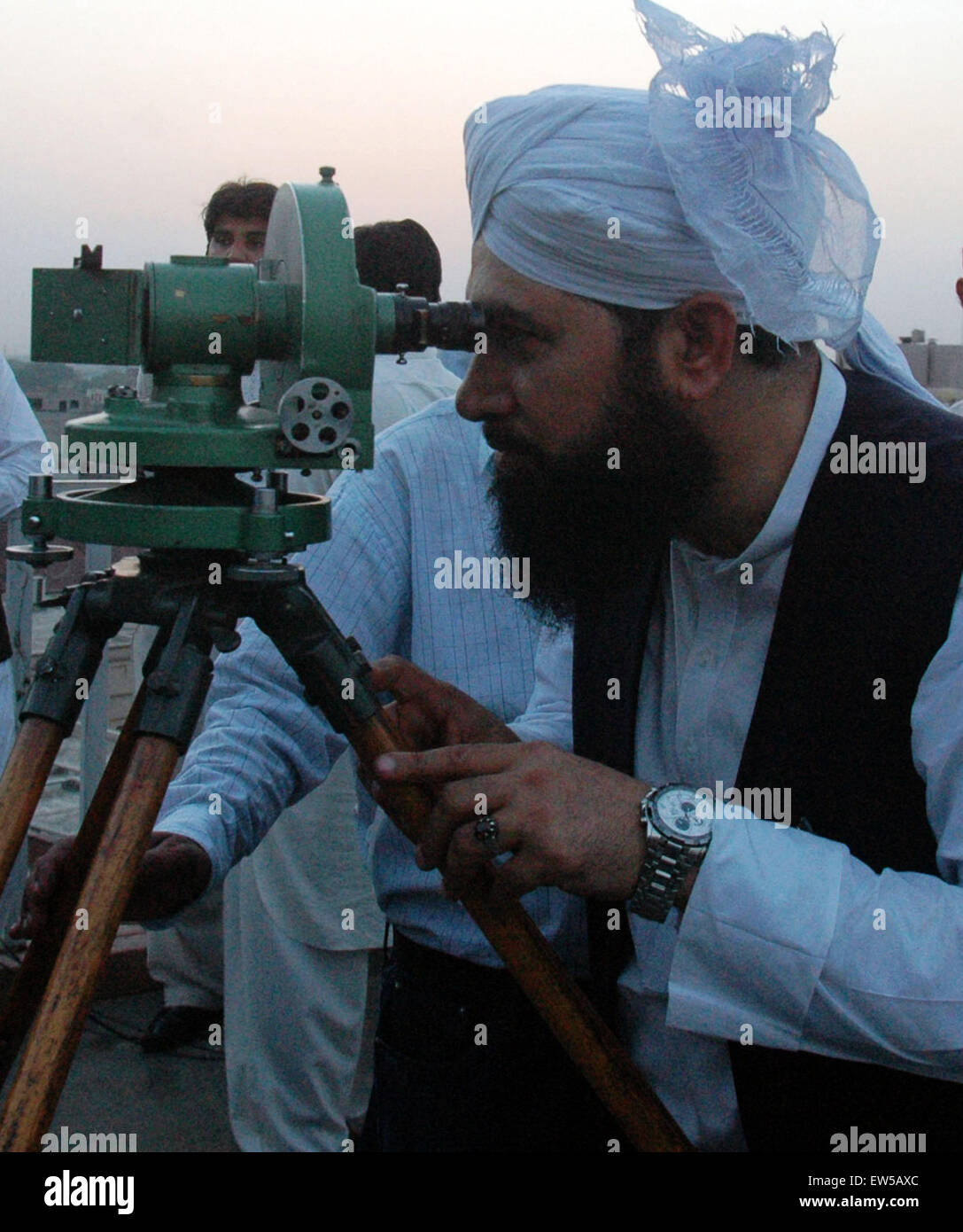 Lahore. 17th June, 2015. A Pakistani Muslim man looks toward the new ...