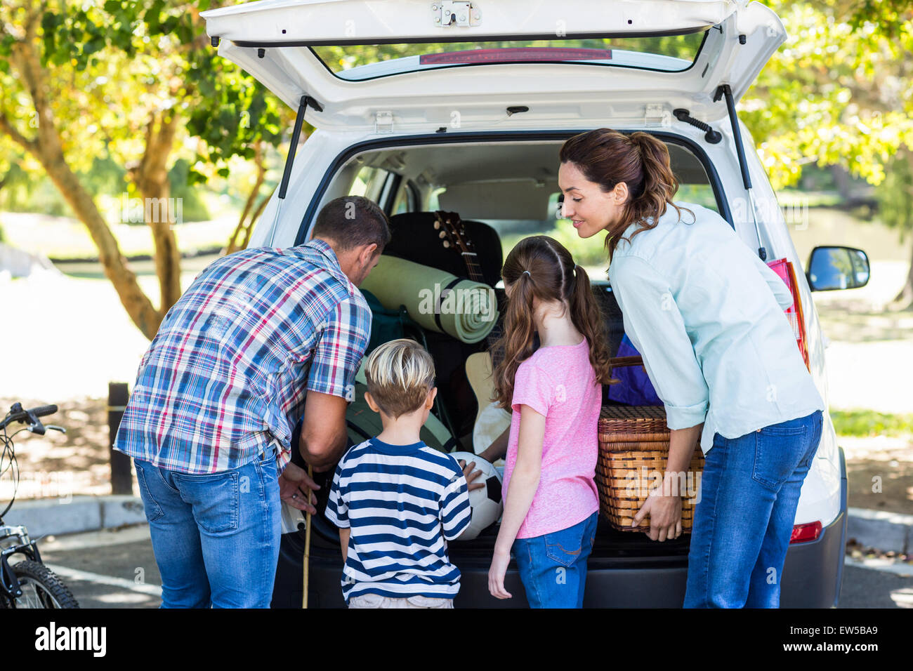 Happy family getting ready for road trip Stock Photo - Alamy