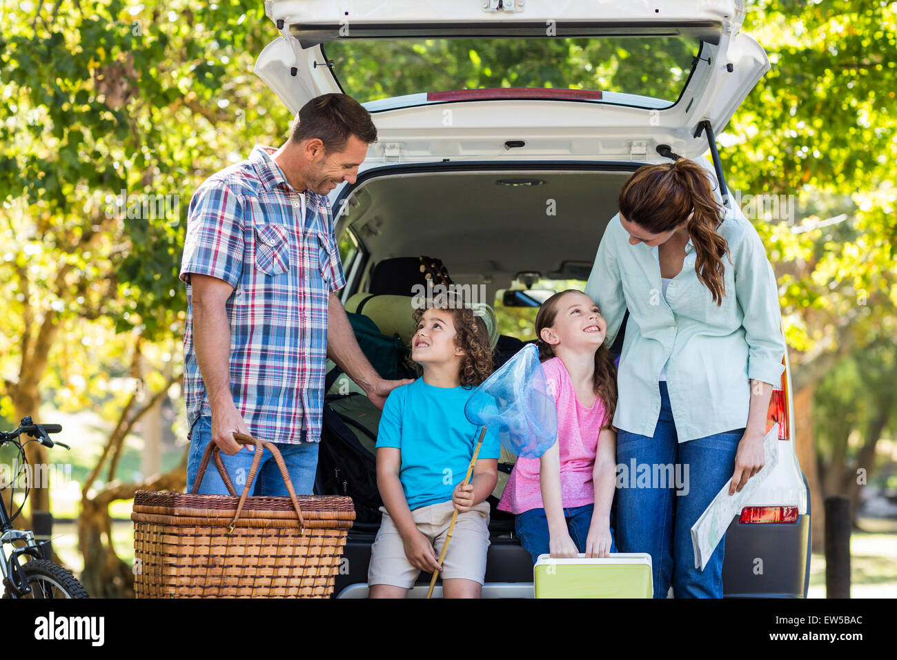 Happy family getting ready for road trip Stock Photo - Alamy