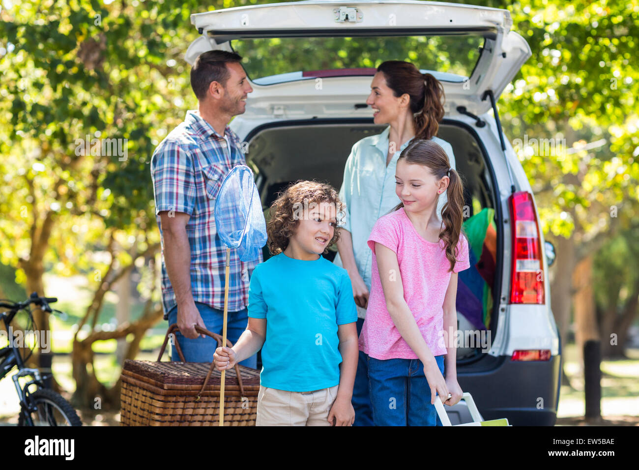 Happy family getting ready for road trip Stock Photo - Alamy