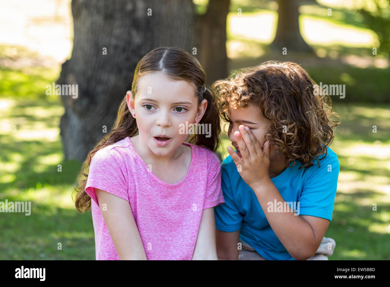 Little siblings smiling at camera Stock Photo - Alamy