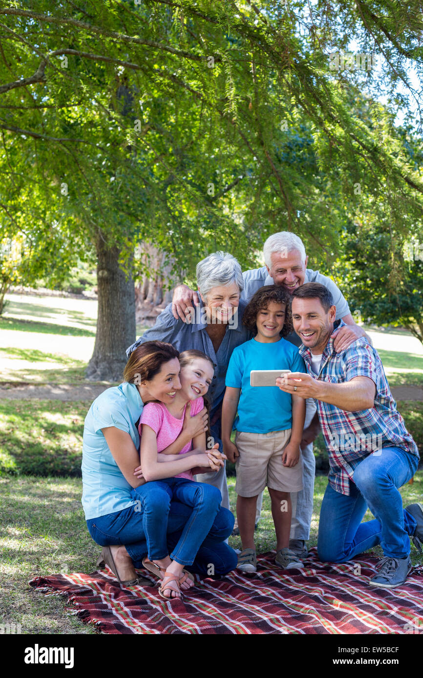 Extended family taking a selfie in the park Stock Photo - Alamy