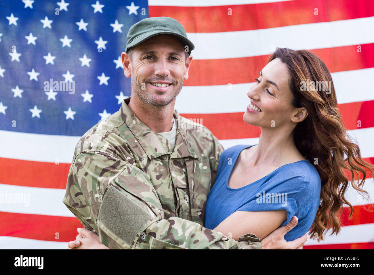 Handsome soldier reunited with partner Stock Photo - Alamy