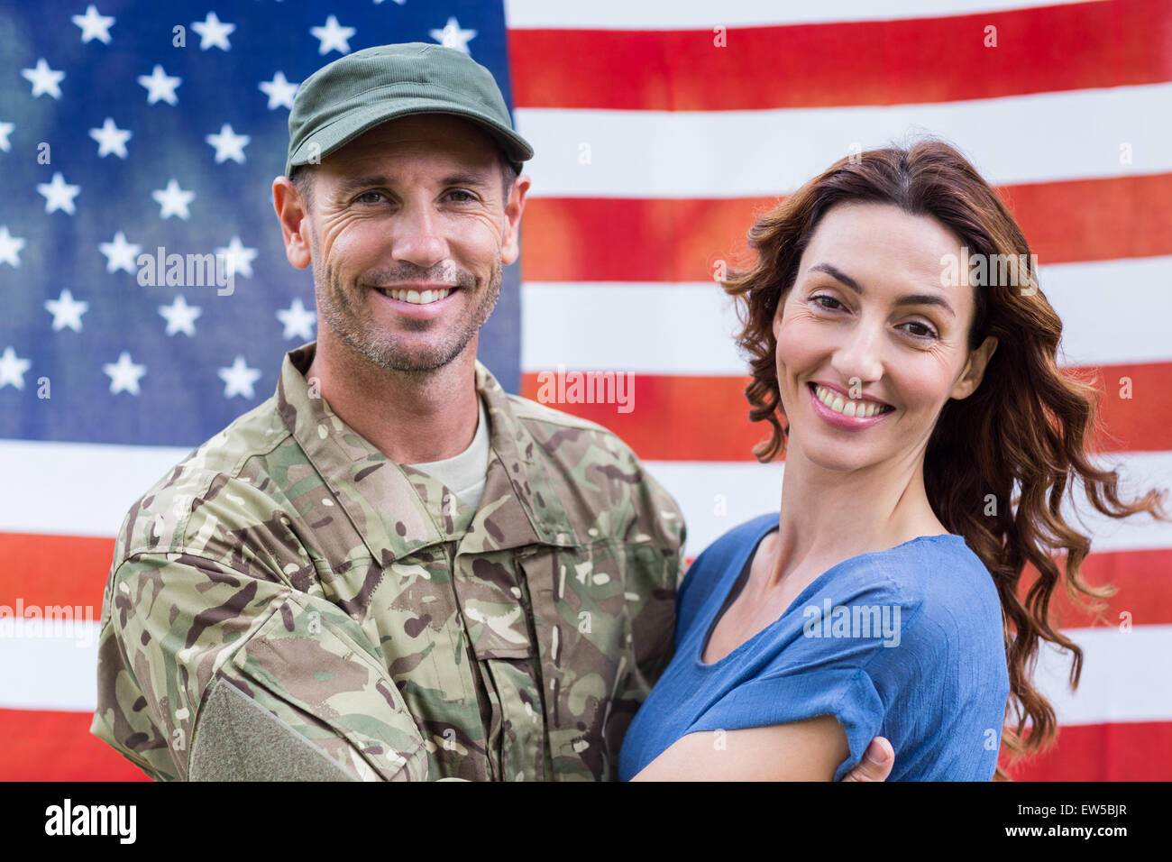 Handsome soldier reunited with partner Stock Photo - Alamy