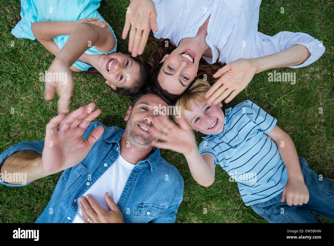 Happy family in the park together Stock Photo - Alamy