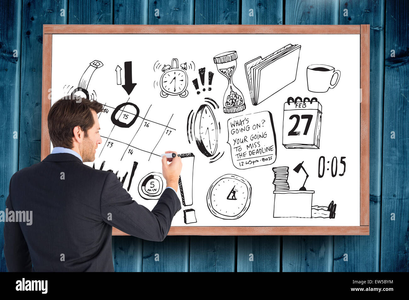 Composite image of businessman standing back to camera writing with ...