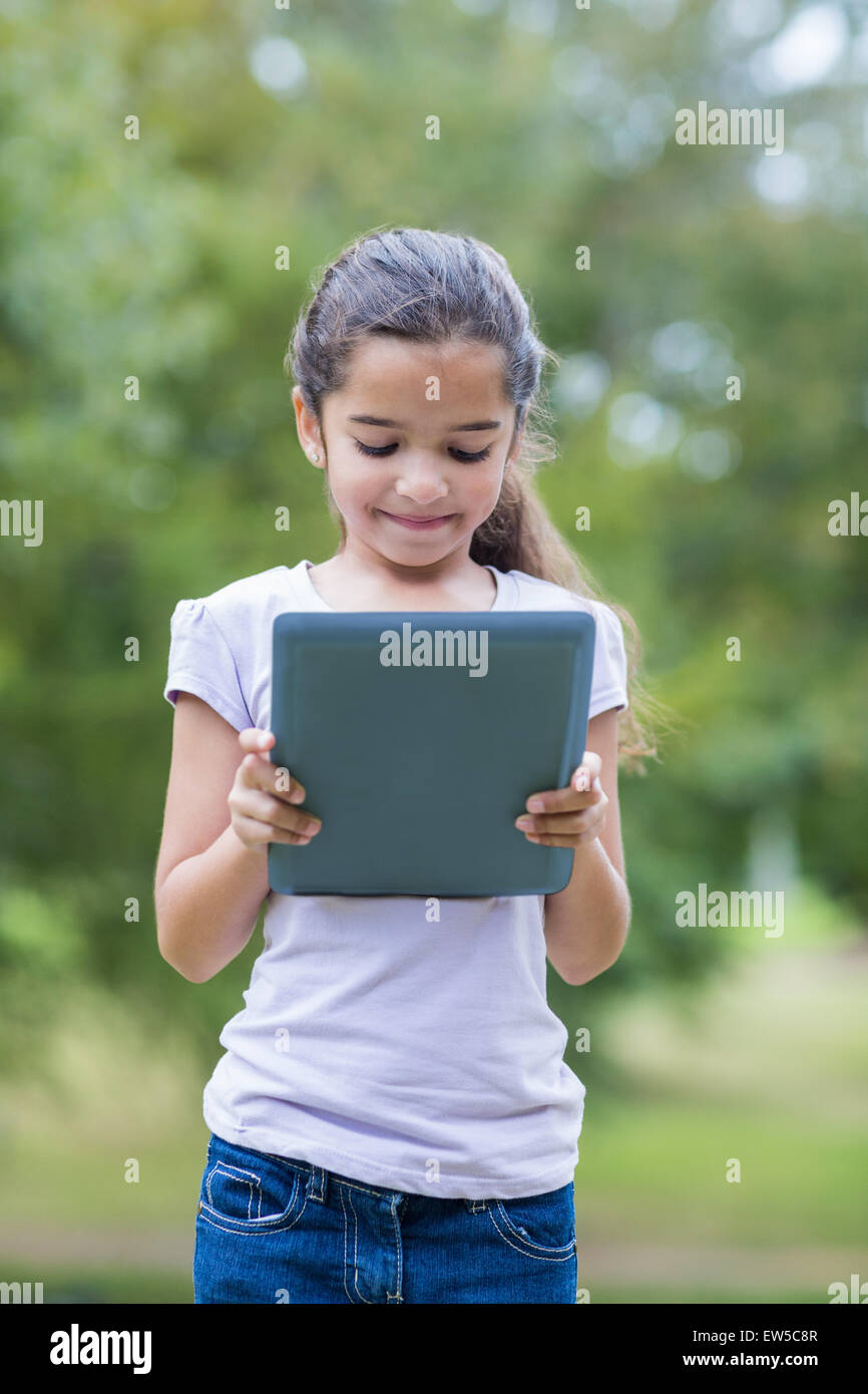 Little girl using her tablet Stock Photo - Alamy