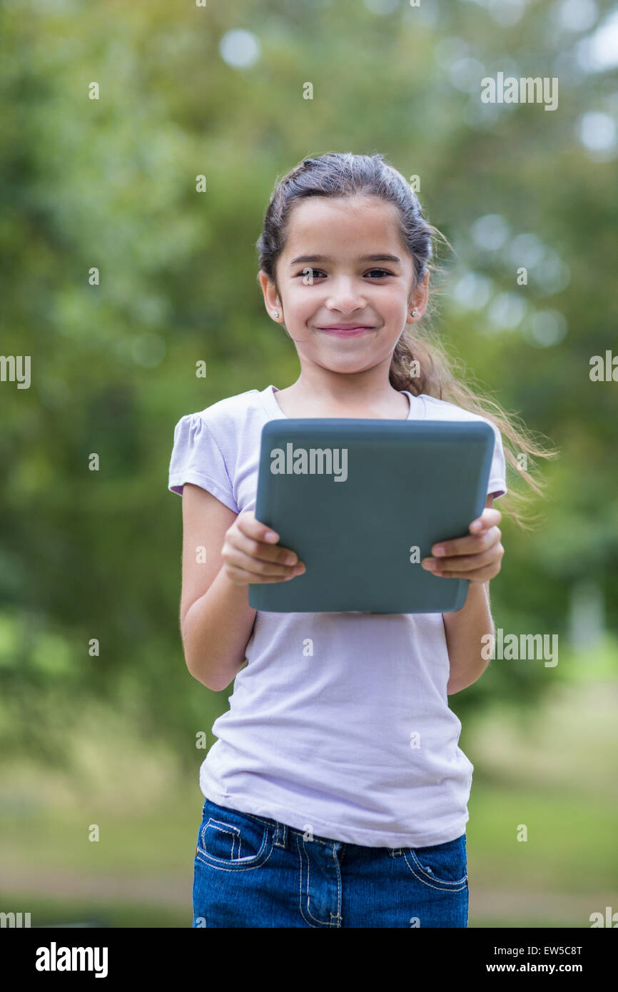Little girl using her tablet Stock Photo - Alamy