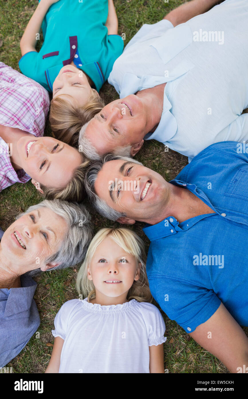 Happy family looking up the camera Stock Photo - Alamy