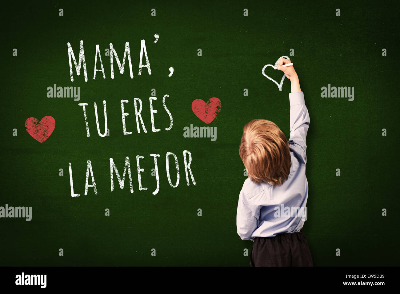 Composite image of cute pupil writing Stock Photo - Alamy