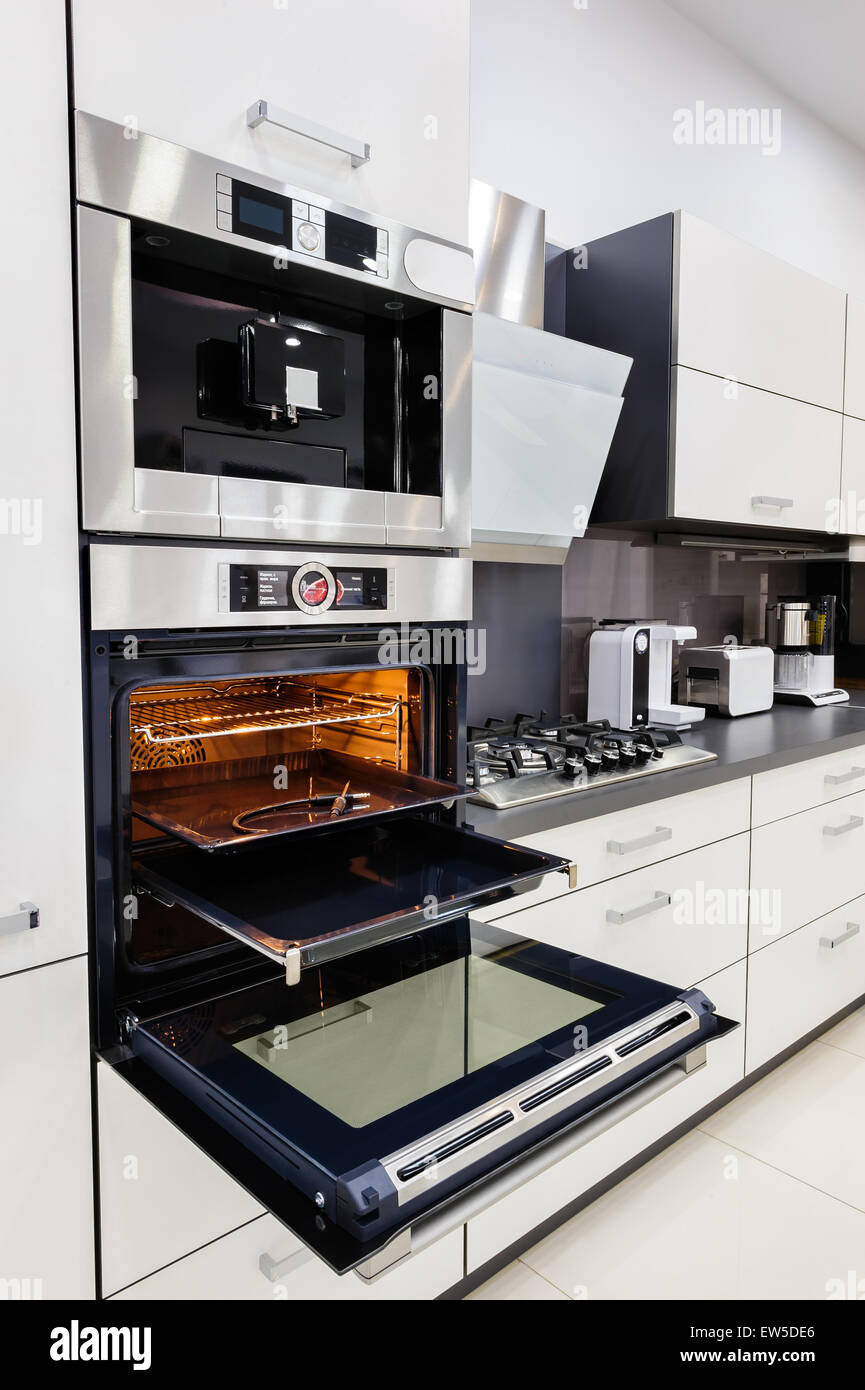 Modern custom hi-tek kitchen, oven with open door Stock Photo - Alamy