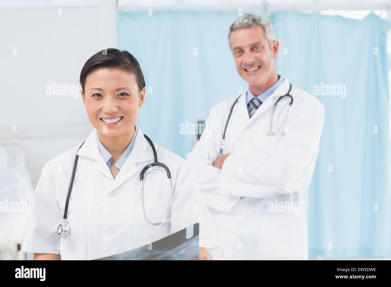 Confident male and female doctors Stock Photo - Alamy