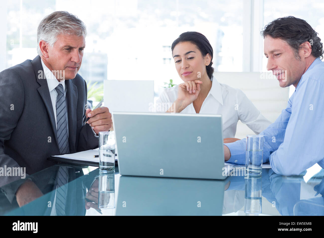 Business people using laptop Stock Photo - Alamy