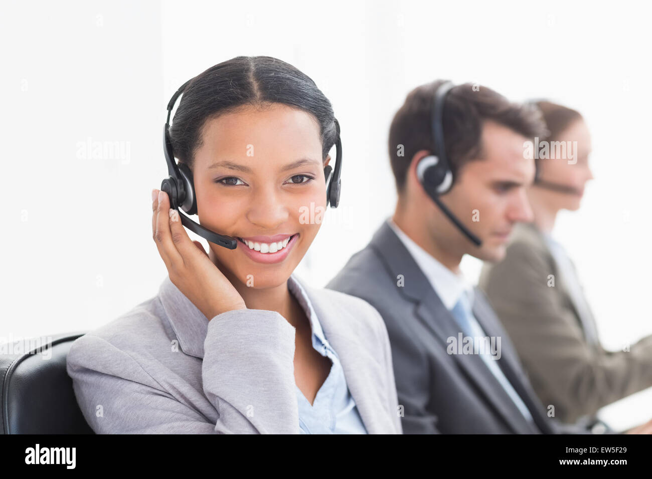 Happy business people using headsets hi-res stock photography and ...