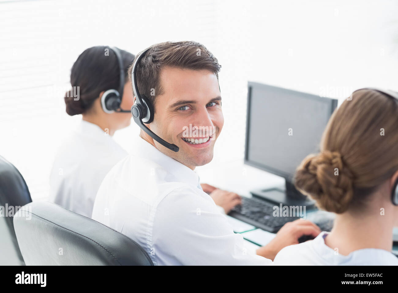Happy business people using headsets hi-res stock photography and ...
