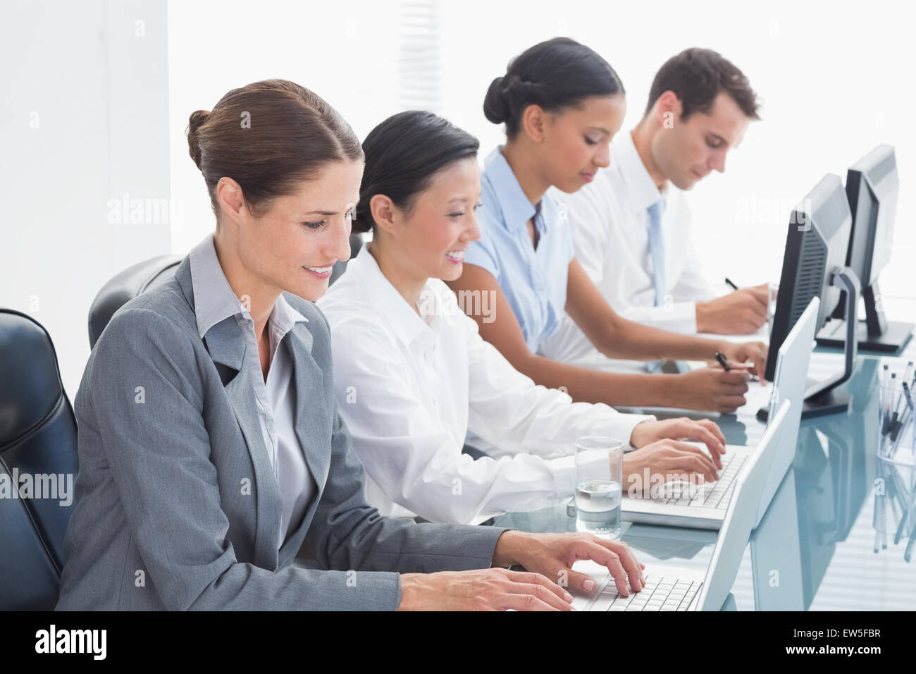 Business people using laptop Stock Photo - Alamy