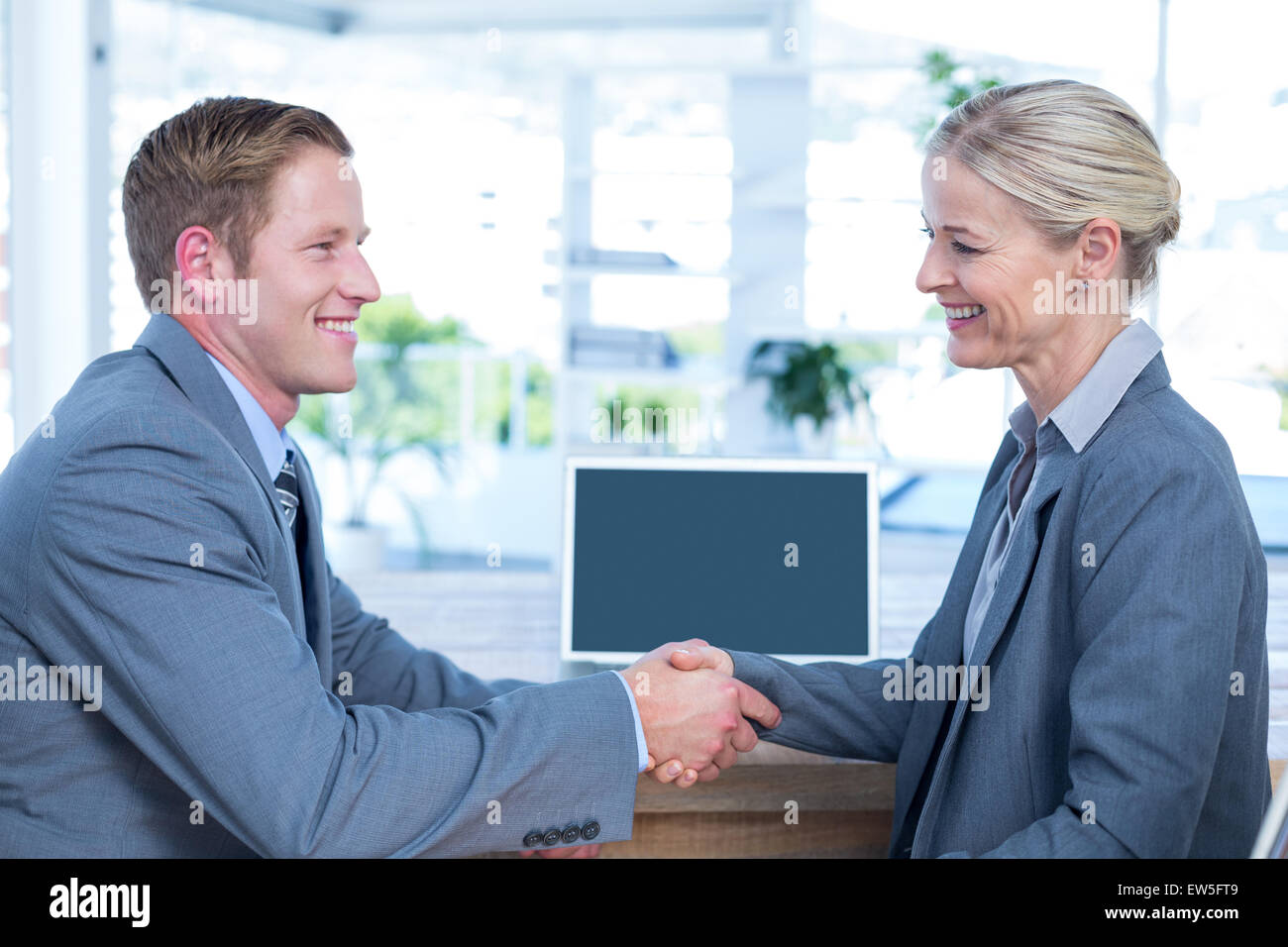 Business partners shaking hand together Stock Photo - Alamy
