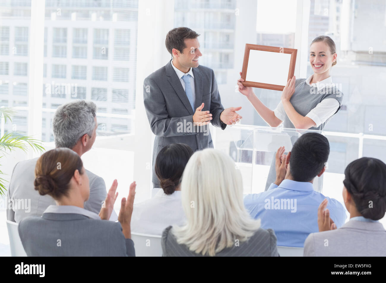 Business people receiving award Stock Photo - Alamy