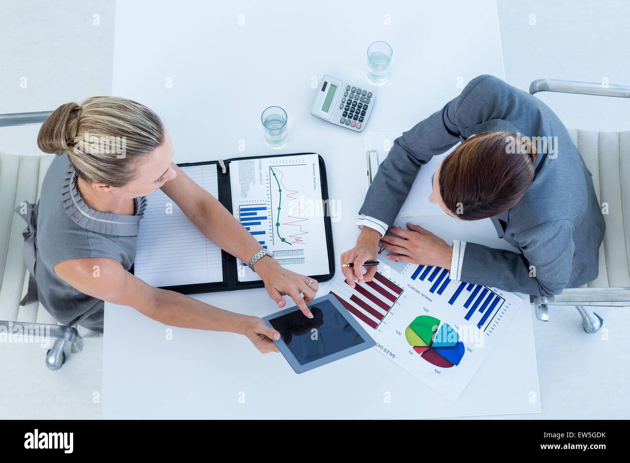 Businesswomen working together Stock Photo - Alamy