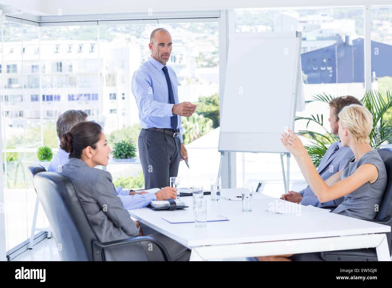 Businesswoman asking question during meeting Stock Photo - Alamy