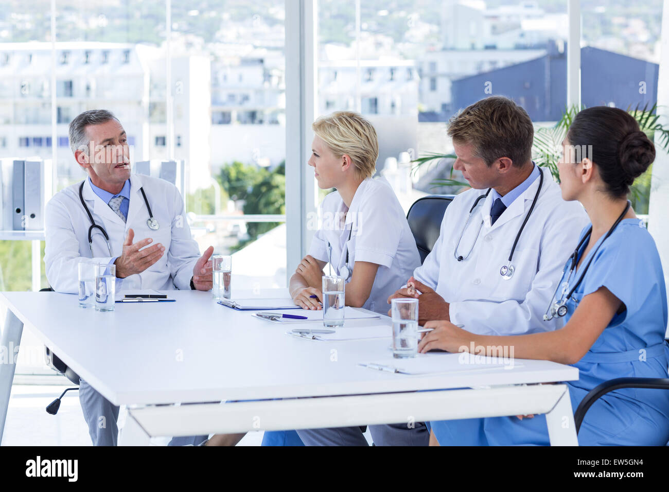 Team of doctor discussing together during meeting Stock Photo - Alamy