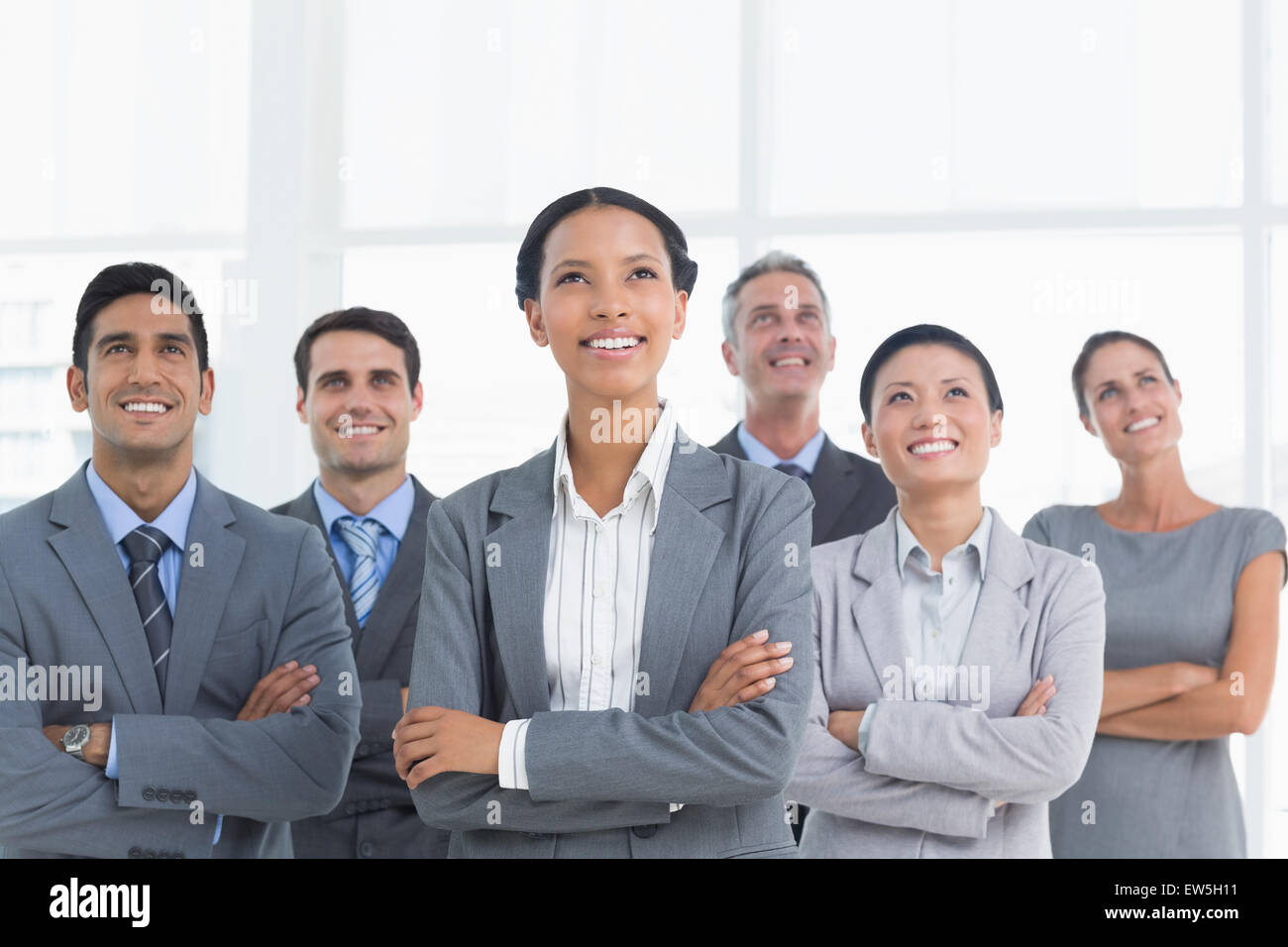 Business people looking up in office Stock Photo - Alamy