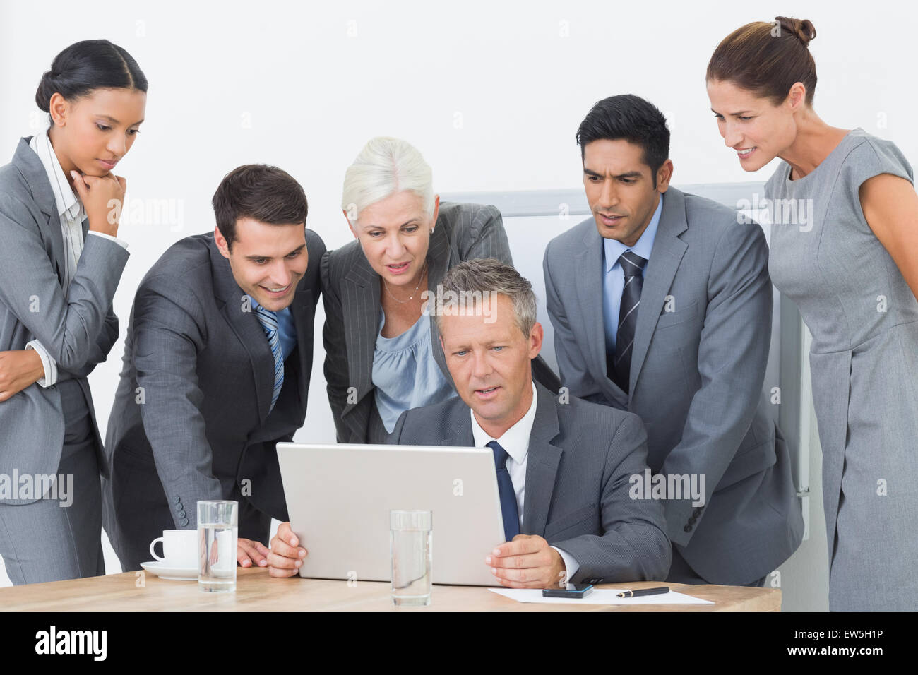 Business people using laptop Stock Photo - Alamy