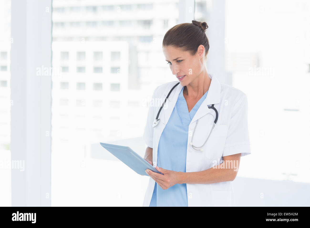 Portrait of a smiling confident female doctor Stock Photo - Alamy