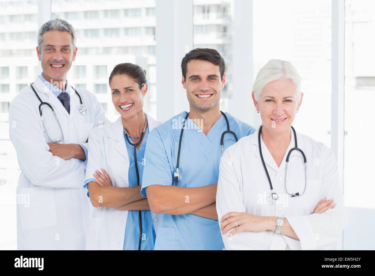 Portrait of confident doctors in row Stock Photo - Alamy