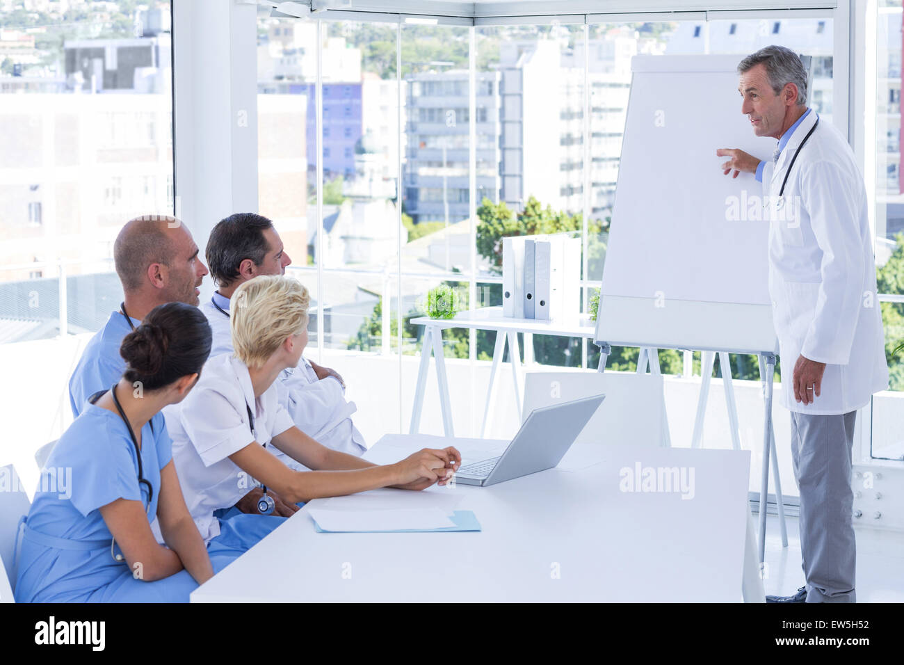 Medical team working together during hi-res stock photography and ...