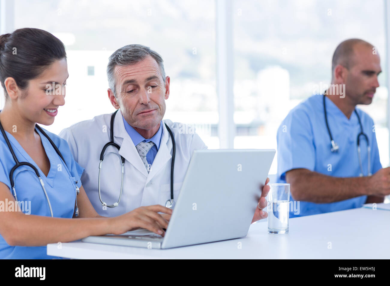 Doctors using computer Stock Photo - Alamy