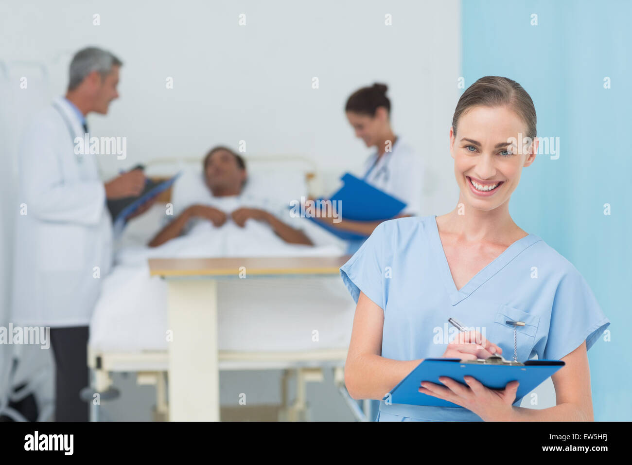 Doctor with colleague and patient behind Stock Photo - Alamy